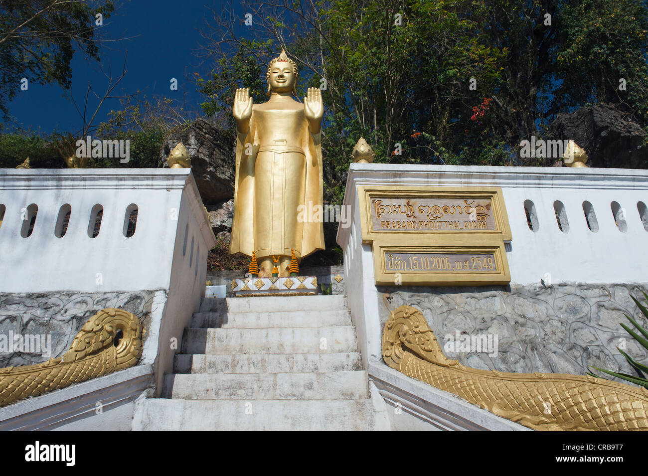 Standing Buddha statue at a temple on Phousi Mountain, Luang Prabang ...