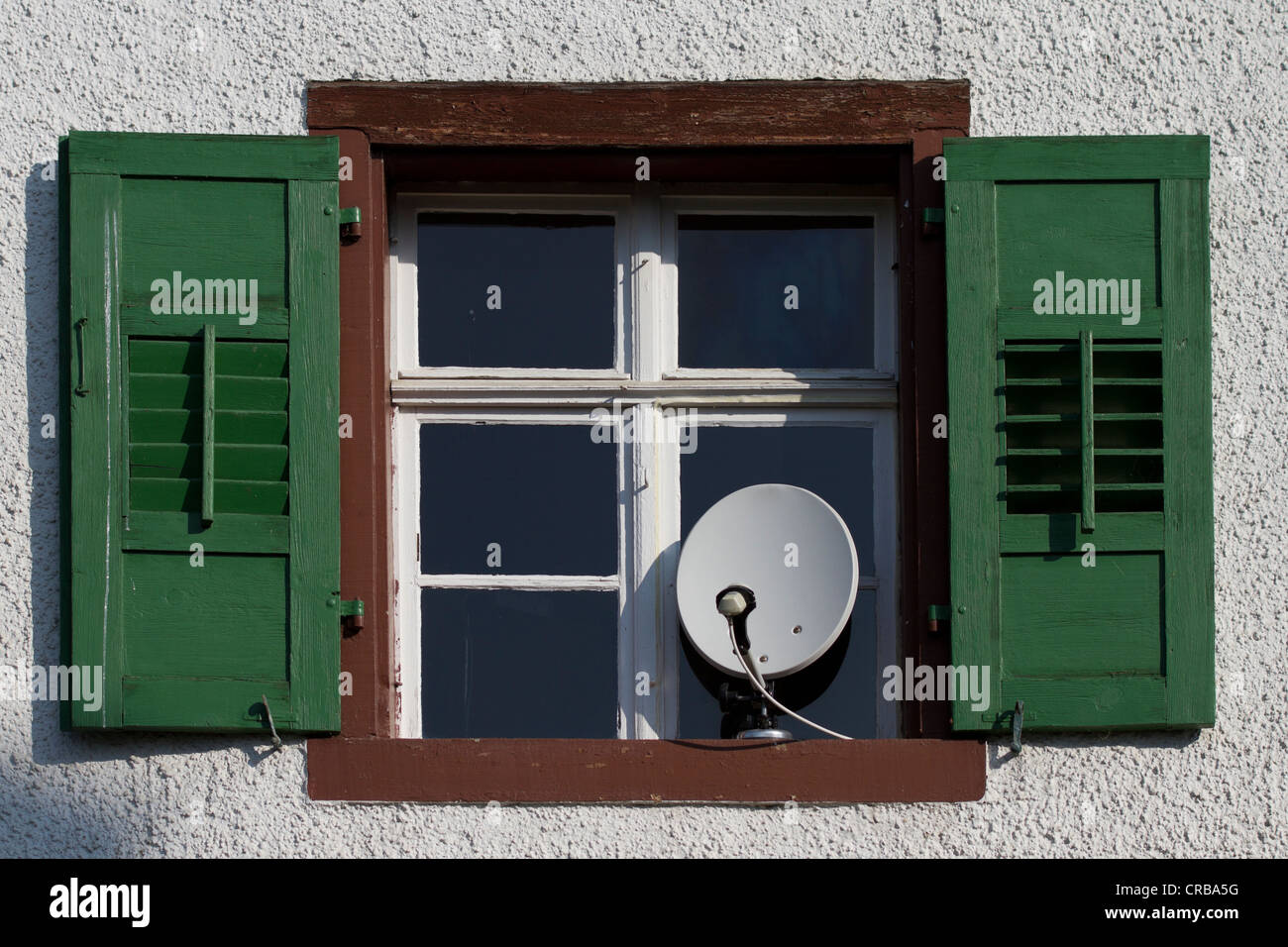 Windows with satellite dish Stock Photo - Alamy