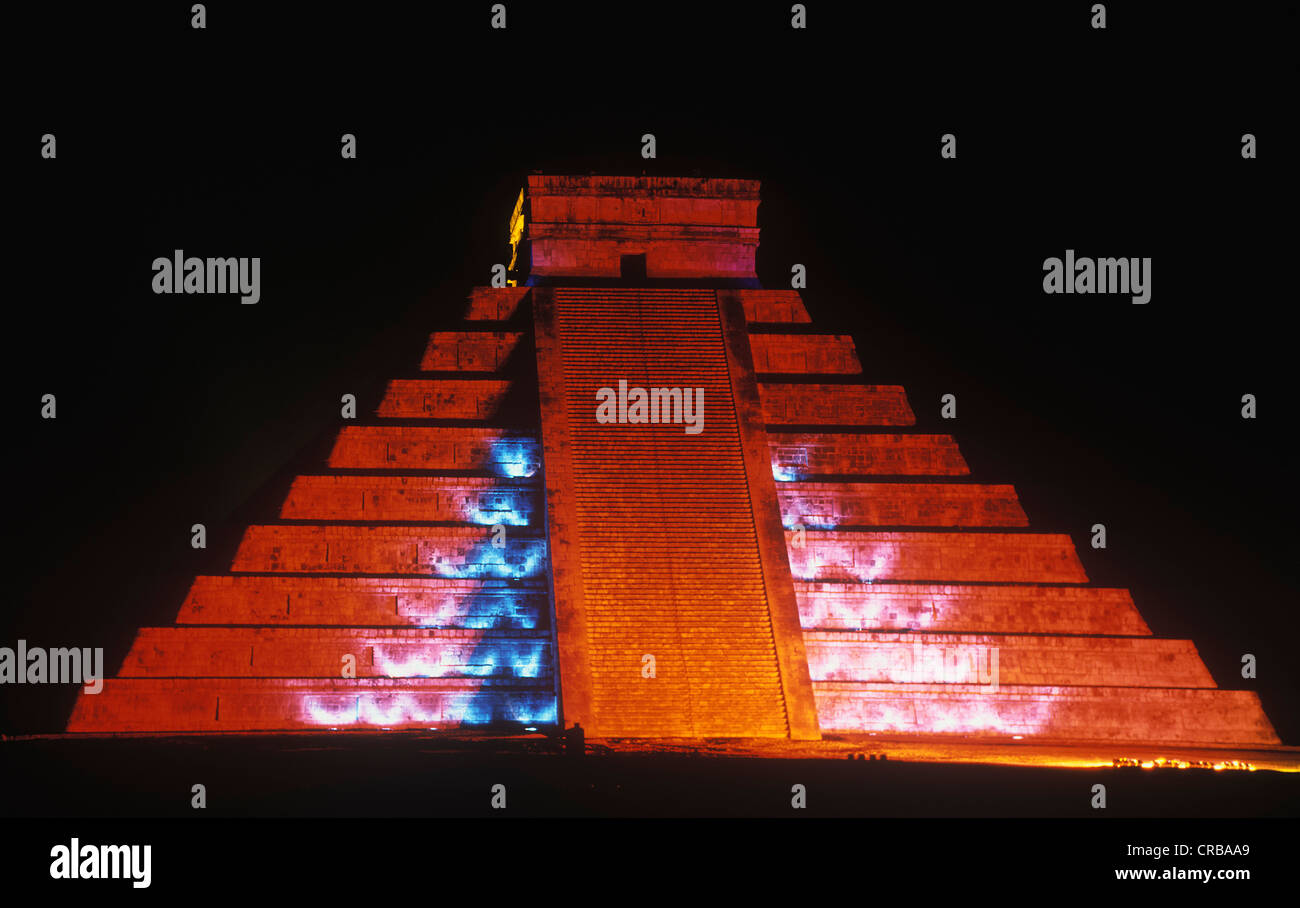 Pyramid of Kukulkan, illuminated red at night, Mayan ruins of Chichen ...