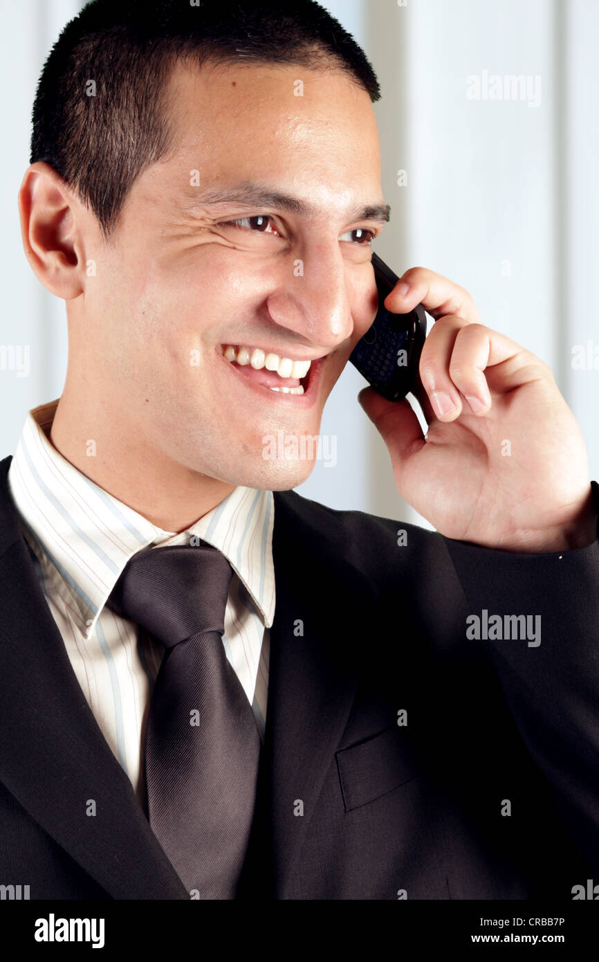Business man talking on cell phone Stock Photo - Alamy