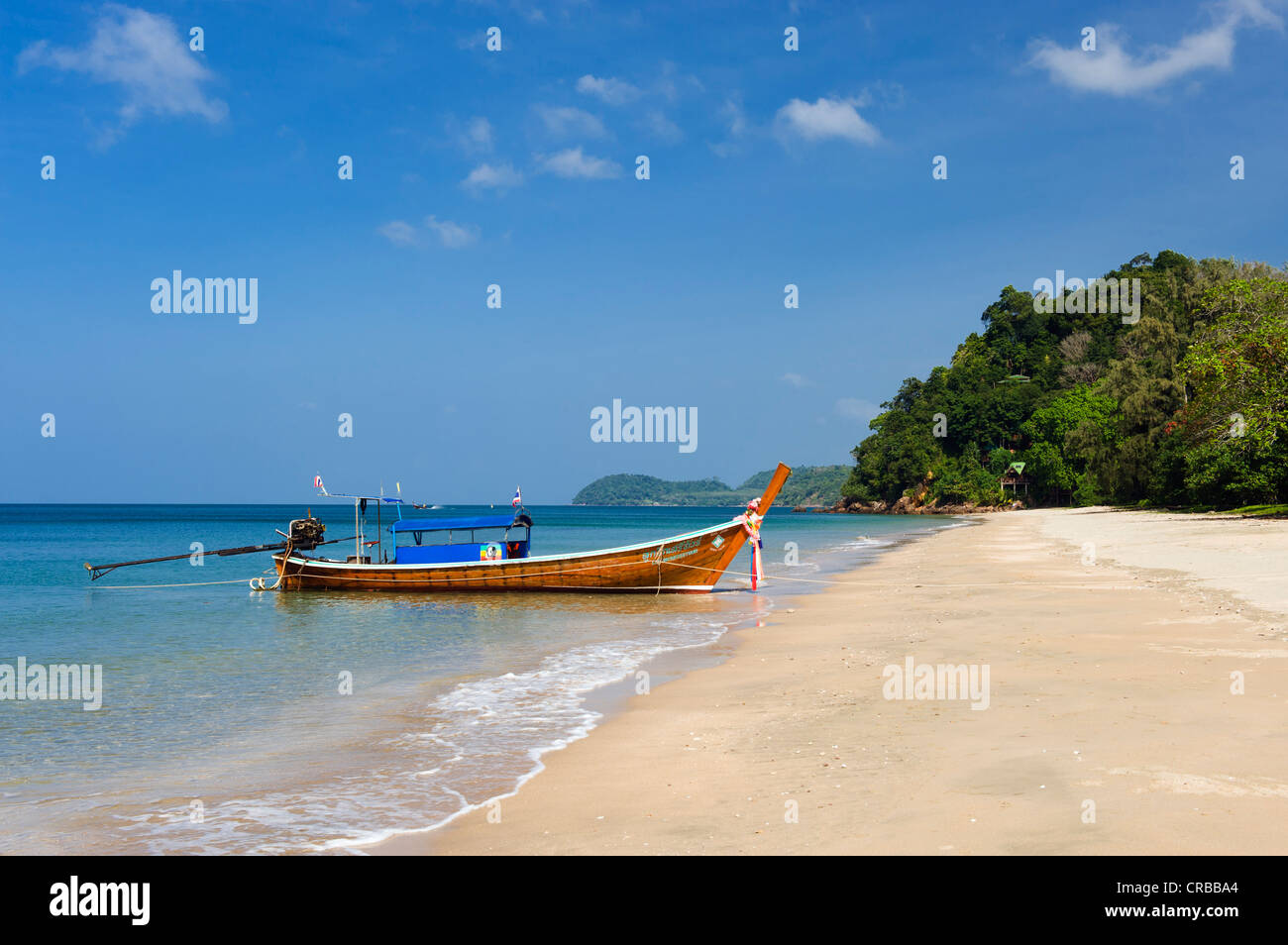Long-tail boat on the sandy beach, Ao Si Beach, Ko Jum or Koh Pu island ...