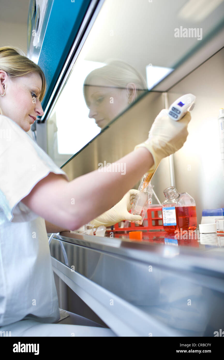 portrait of a female researcher doing research in a lab (color toned ...