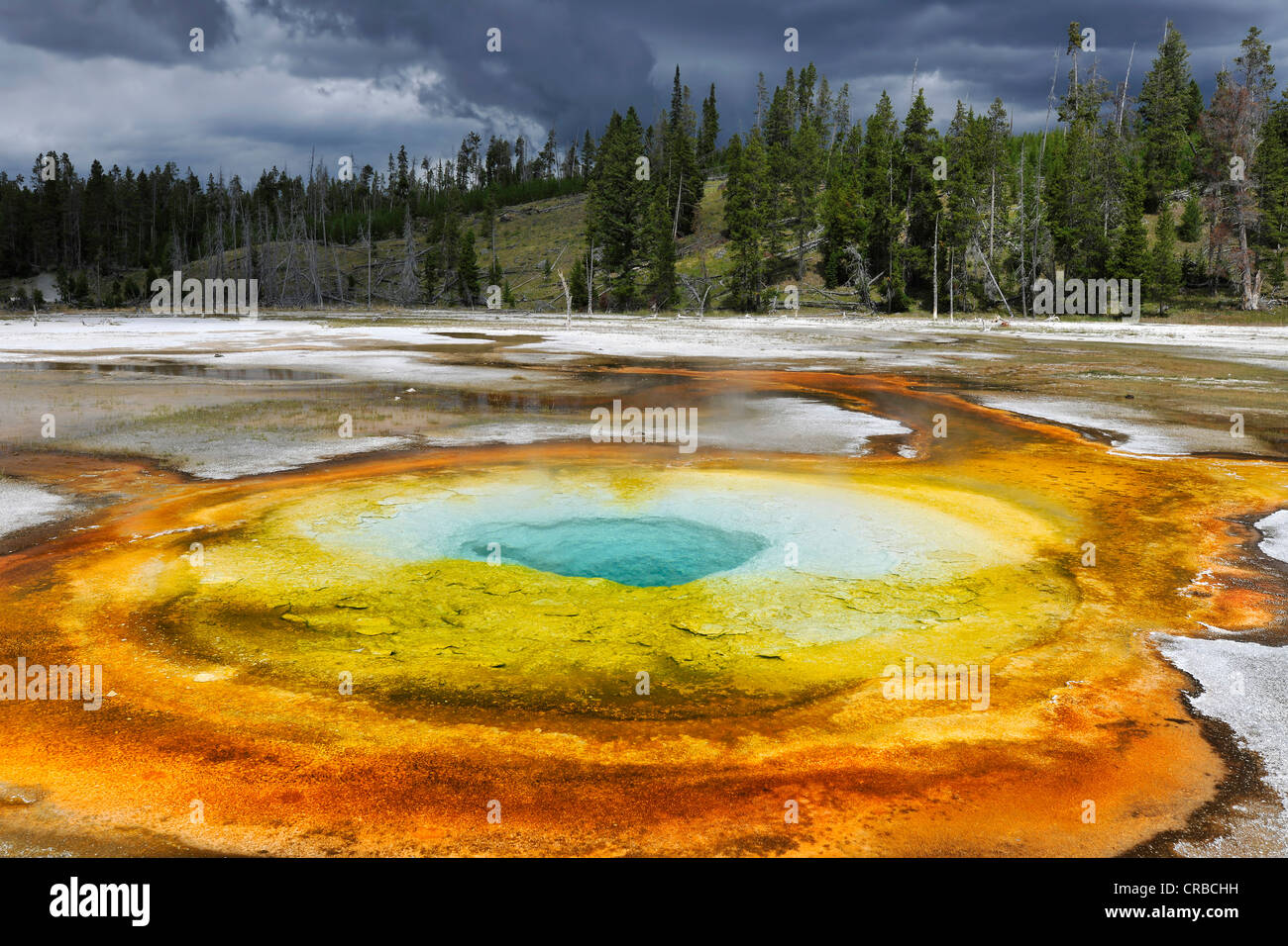 Chromatic Pool Geyser, thunderstorm clouds at the back, Upper Geyser ...