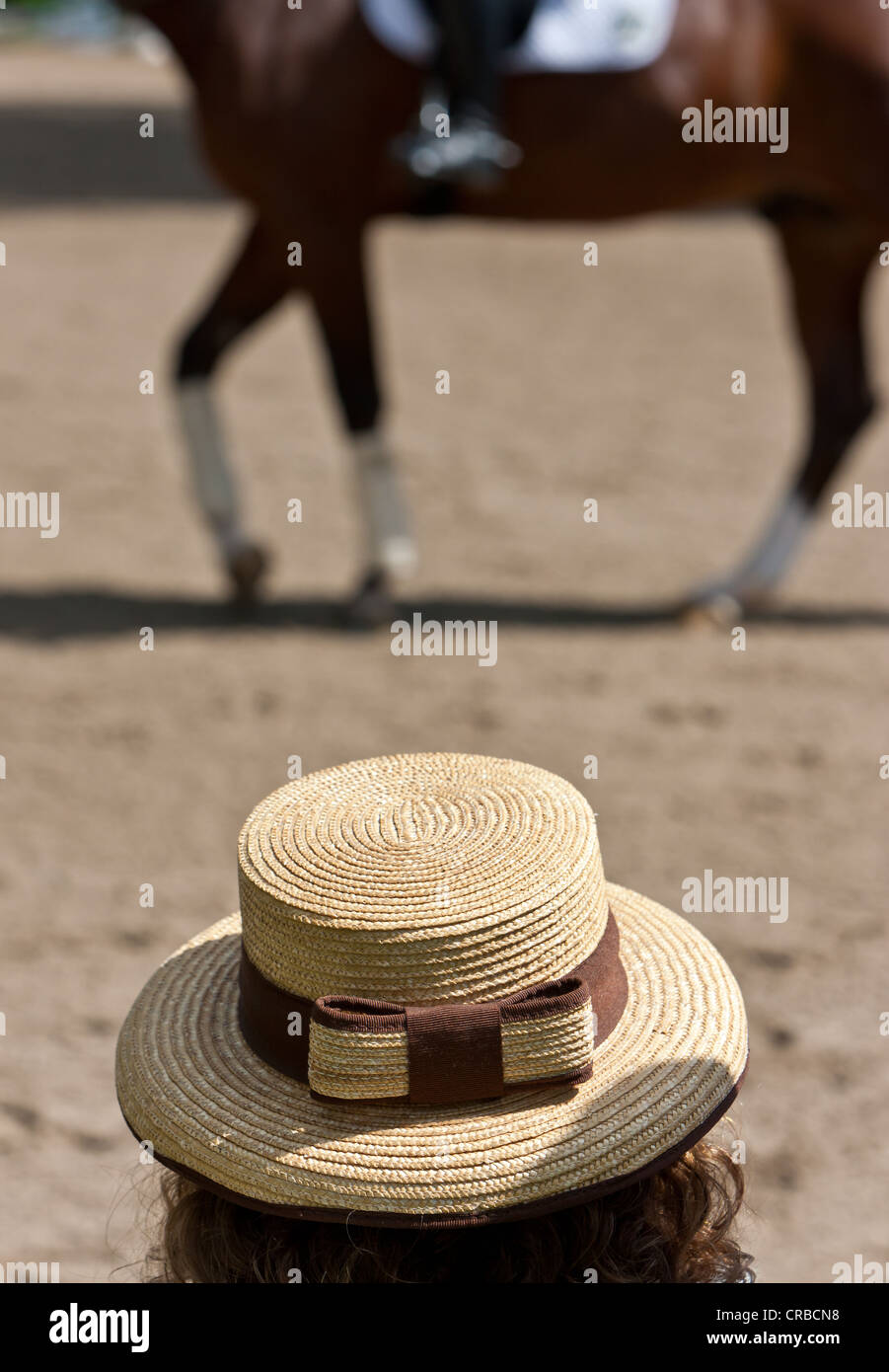 Spectator wearing a hat, International Pentecostal show jumping and ...