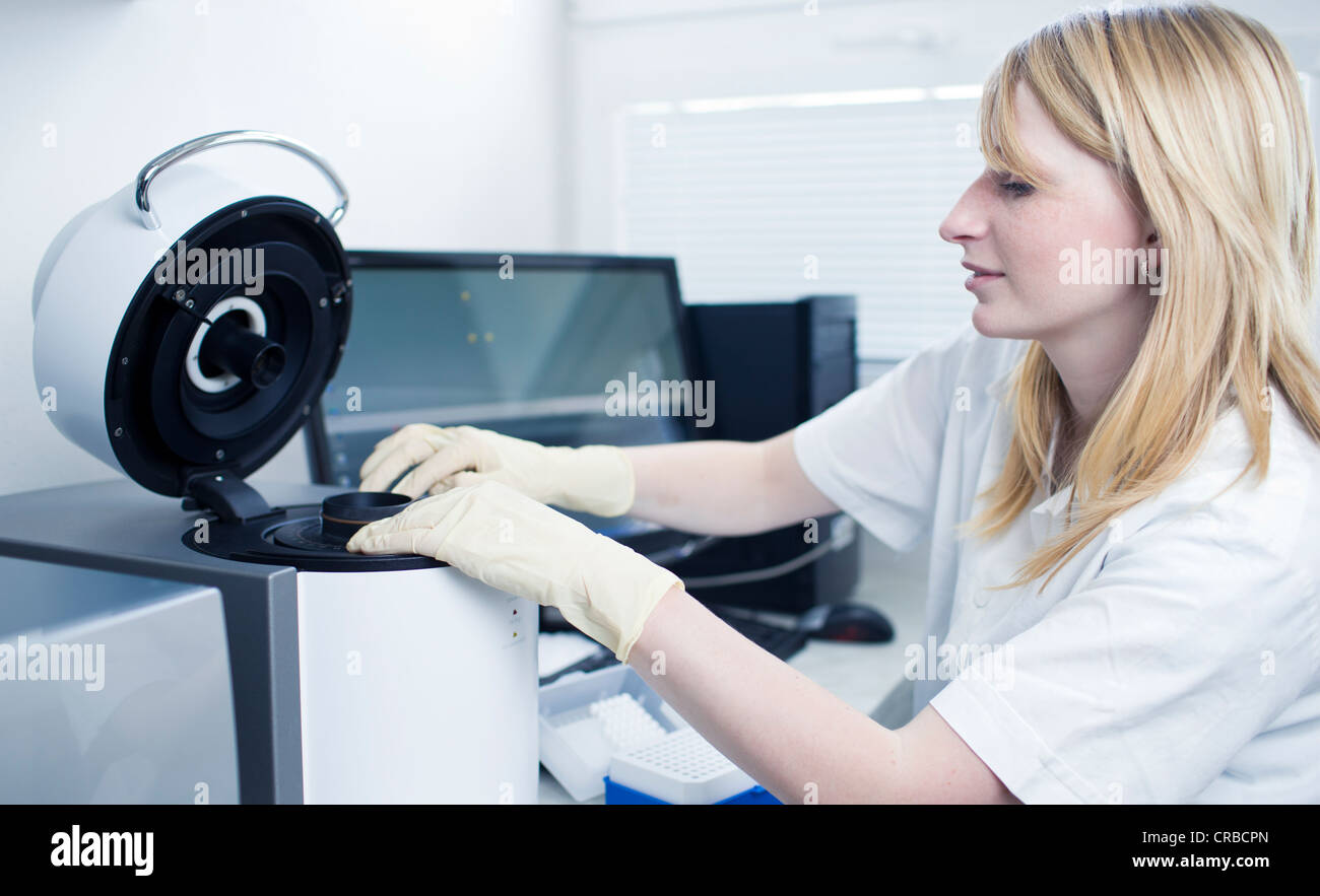 portrait of a female researcher doing research in a lab (color toned ...