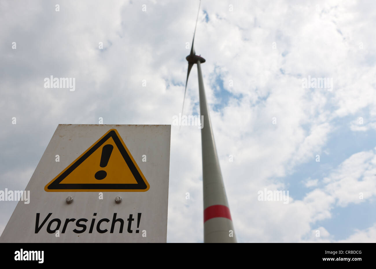 Danger sign, lettering "Vorsicht", German for "Caution", wind turbine ...