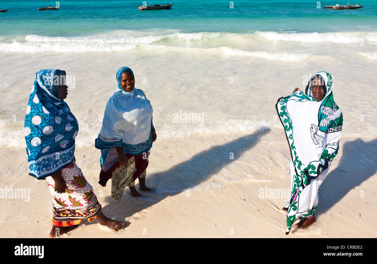 Muslim women on the beach in Zanzibar, Tanzania, Africa Stock Photo - Alamy