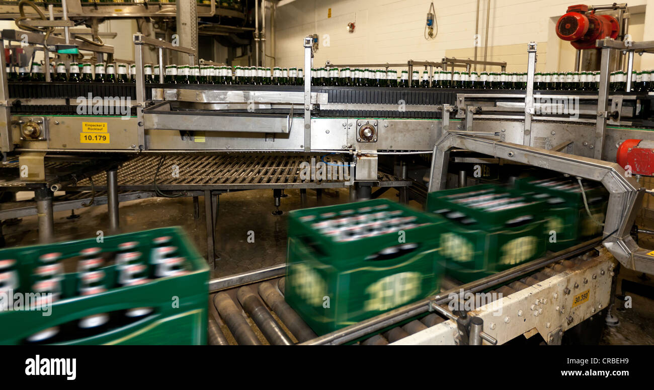 Filled beer crates on a conveyor belt with motion blur, Binding brewery ...