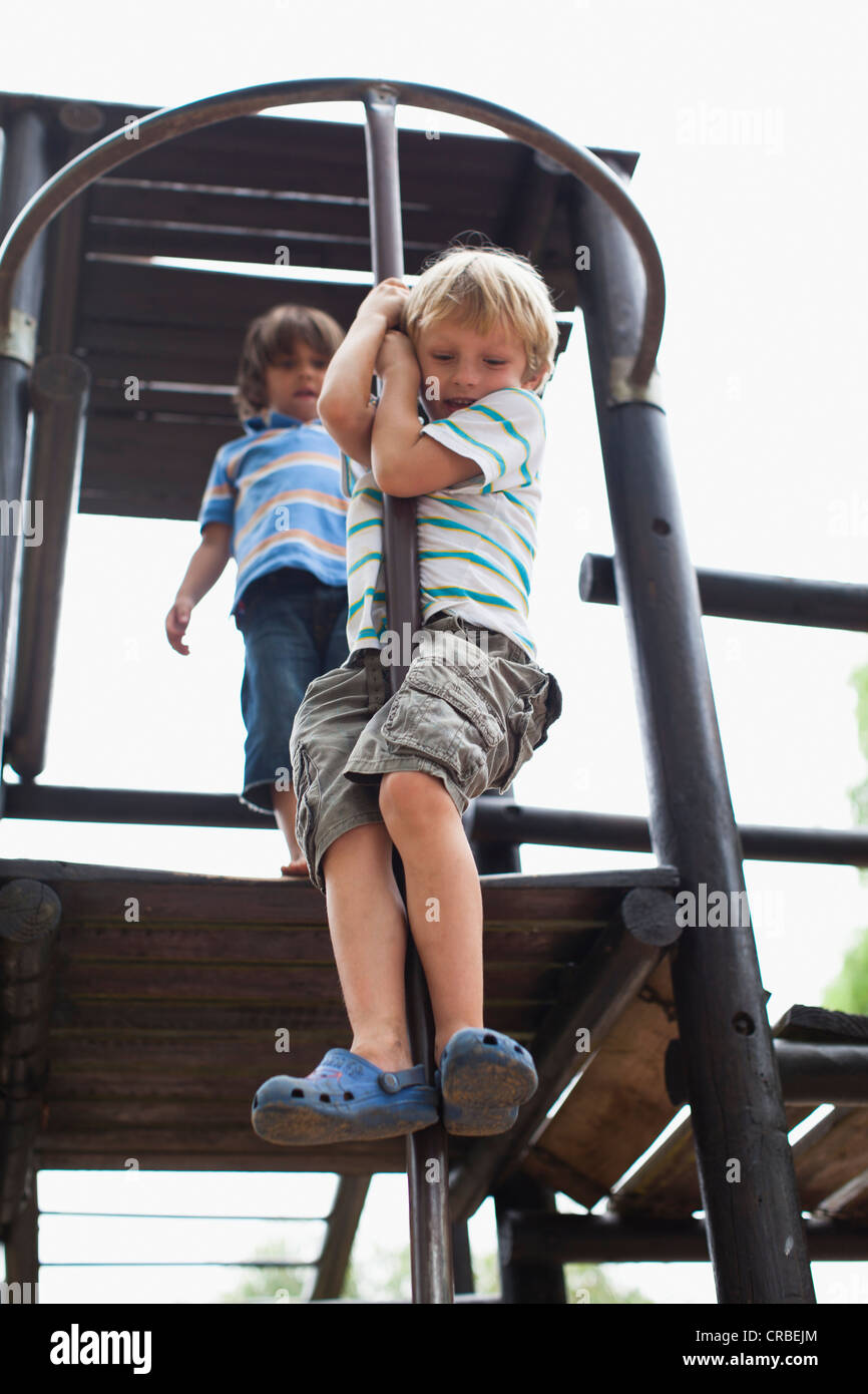 Children playing on pole hi-res stock photography and images - Alamy