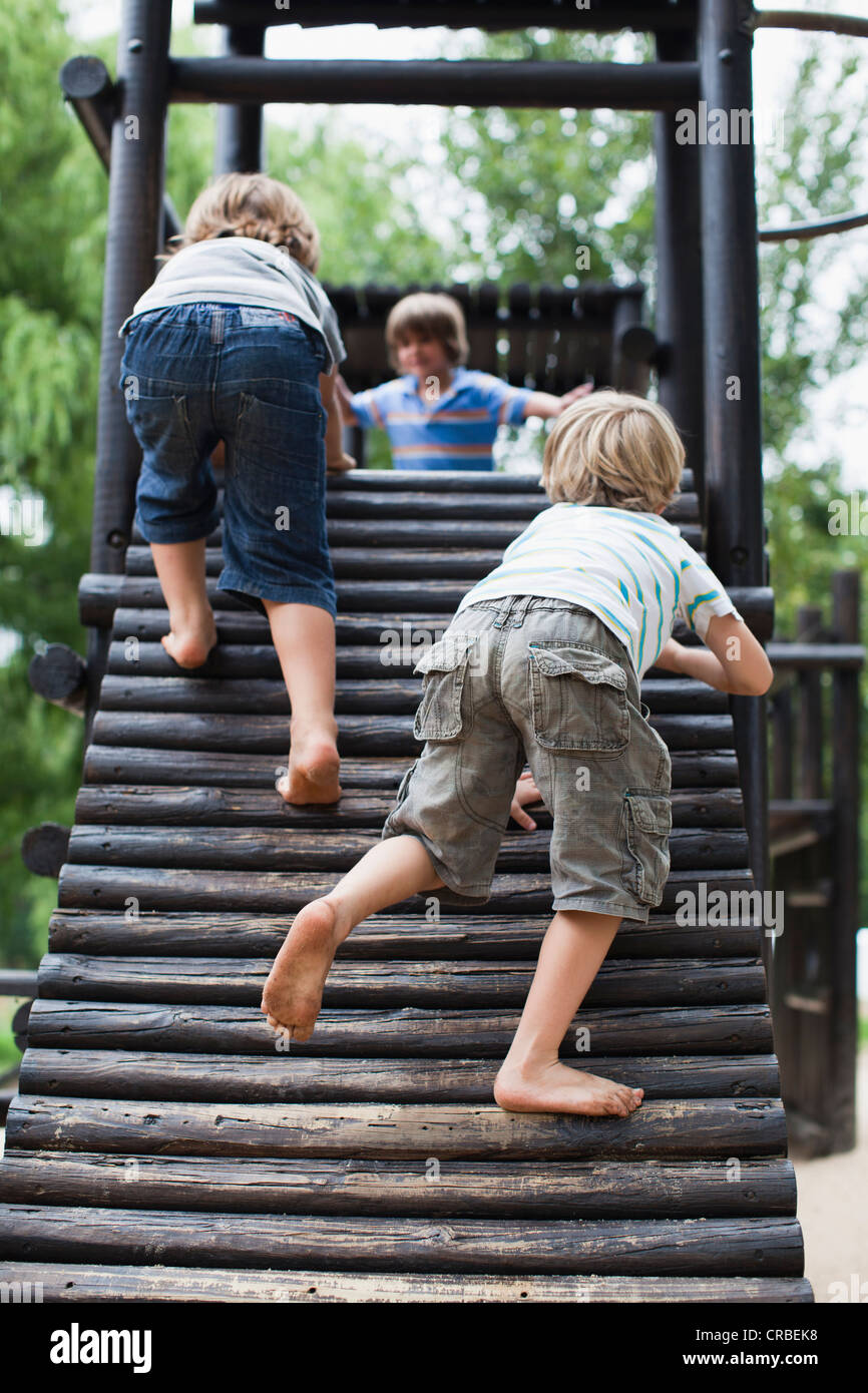 Three boys climb hi-res stock photography and images - Alamy