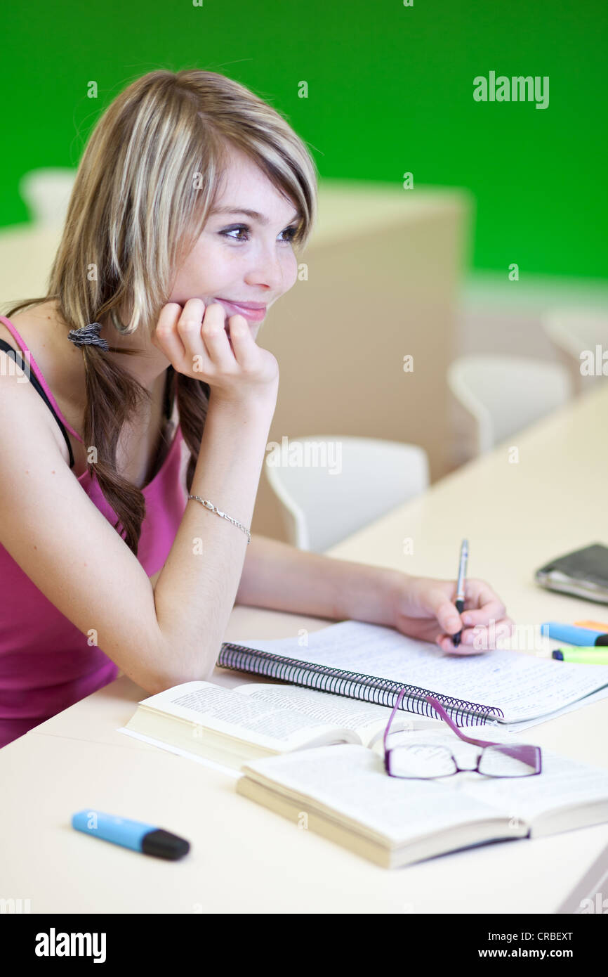 Portrait of a pretty young college student in a classroom Stock Photo ...