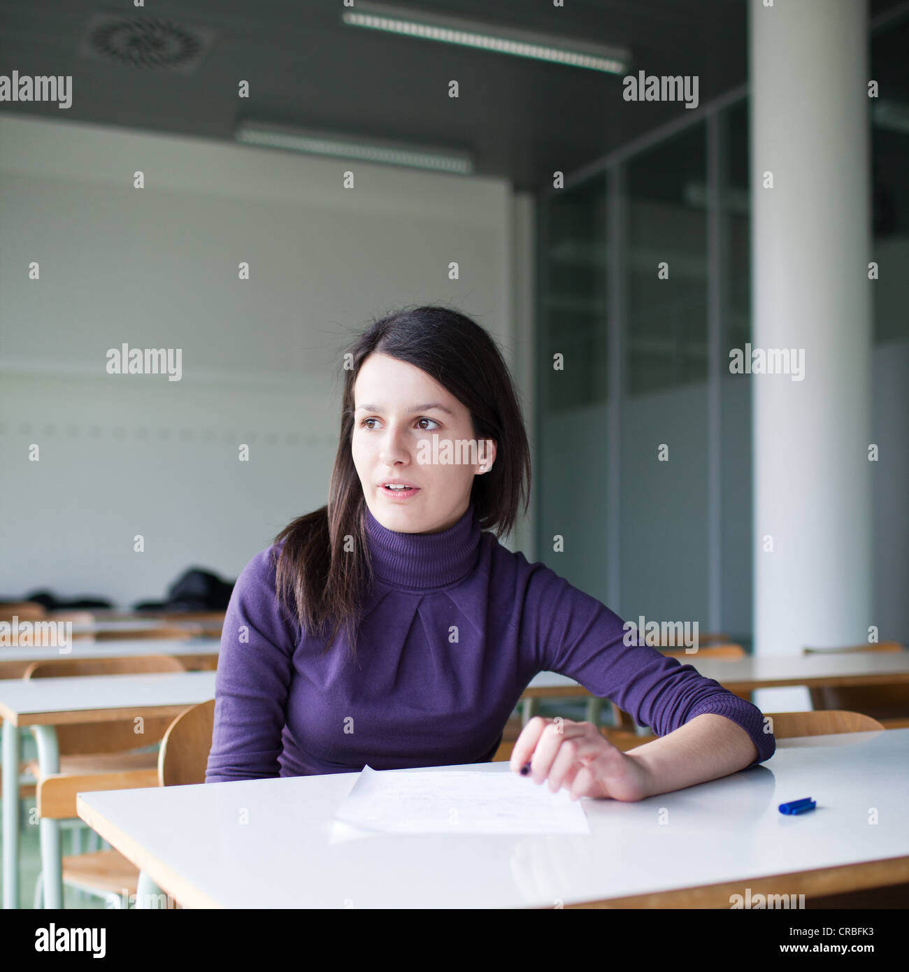portrait of a pretty college student working in a classroom Stock Photo ...