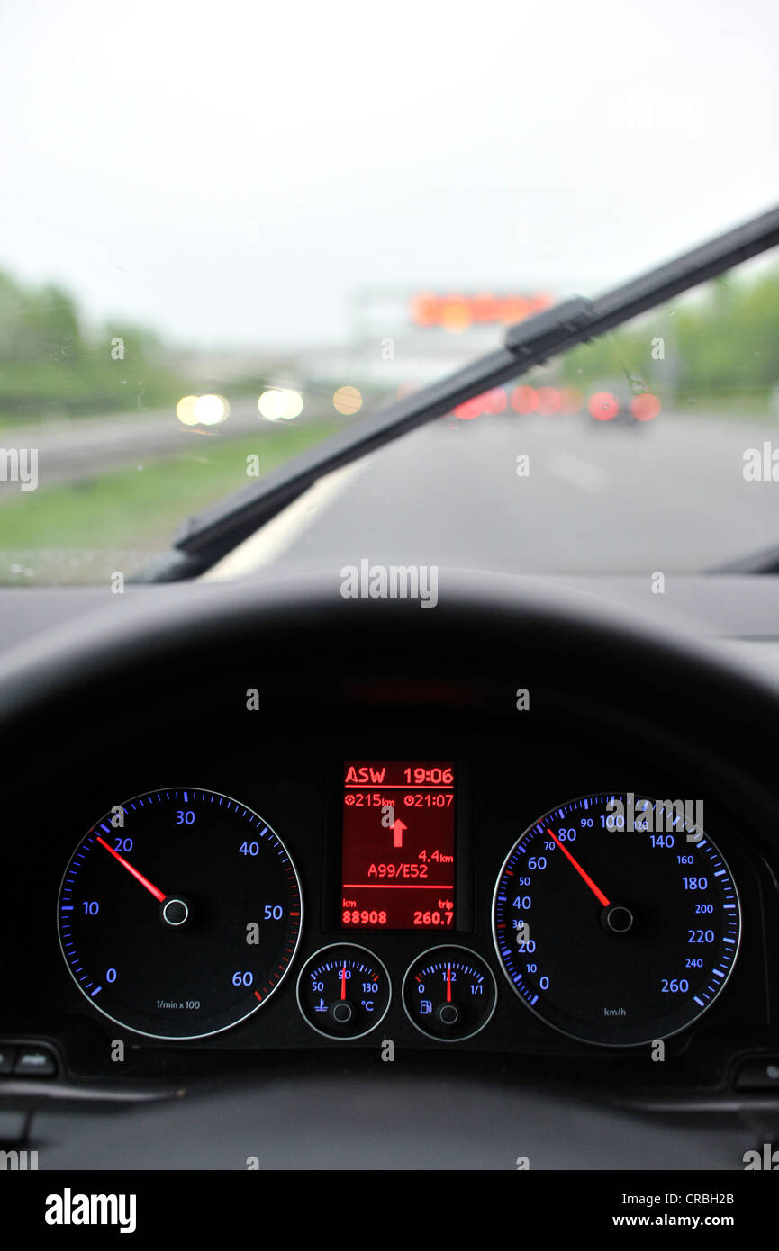 Poor visibility in rain, highway, illuminated speedometer with ...