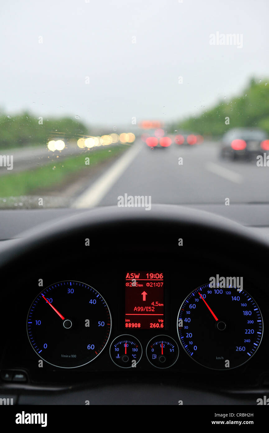 Poor visibility in rain, highway, illuminated speedometer with ...
