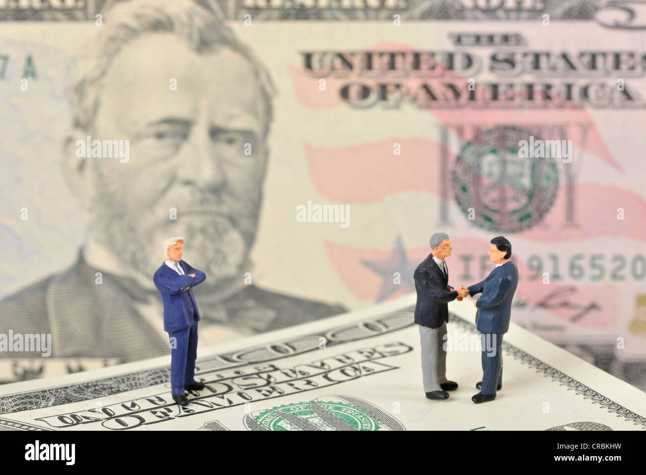 Manager figures in U.S. dollar bill, symbolic image for business ...