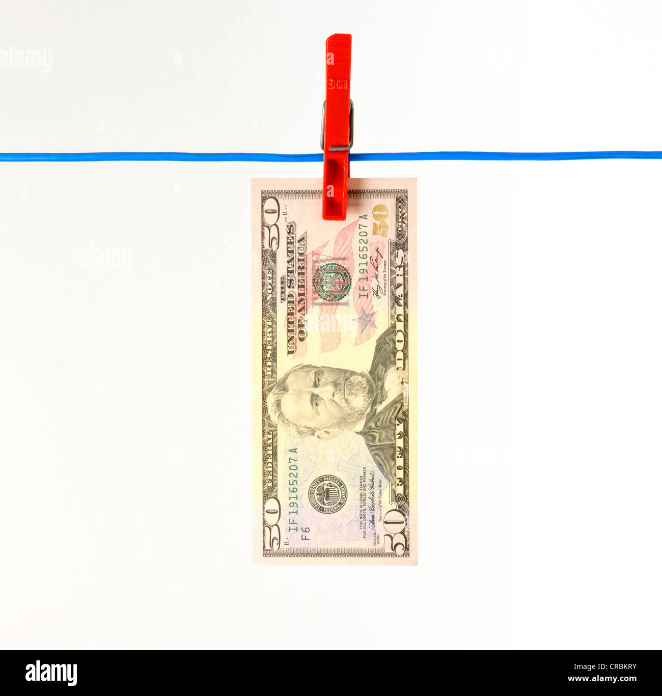 U.S. dollar bank note on a clothesline, symbolic image for money ...