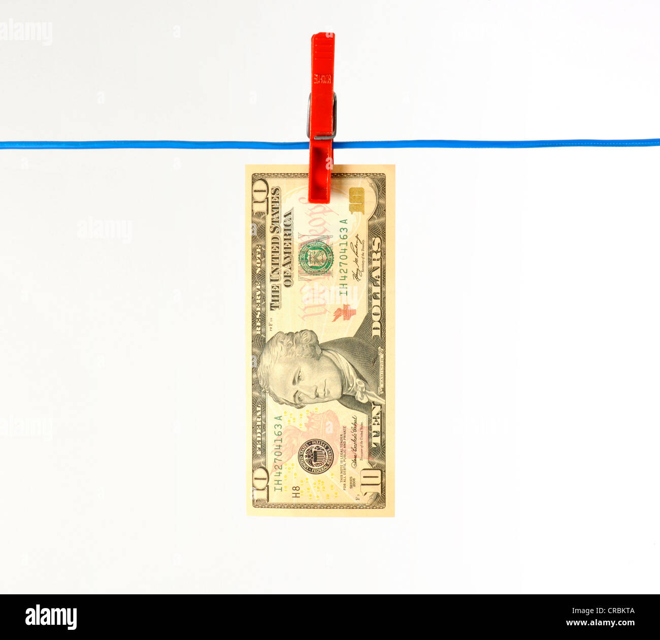 U.S. dollar bank note on a clothesline, symbolic image for money ...