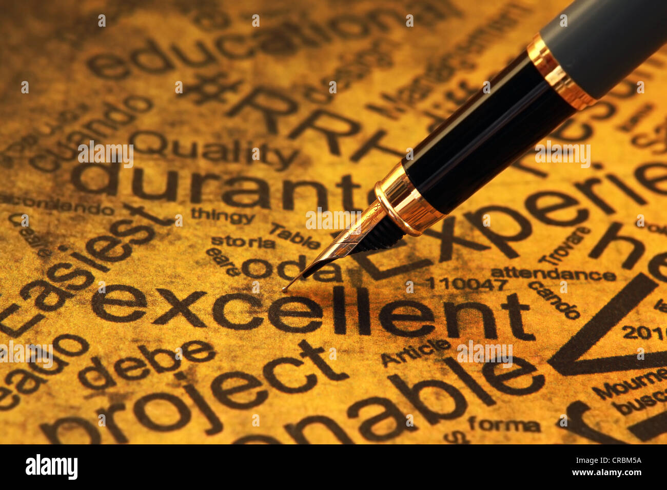 Pen on excellent text Stock Photo - Alamy
