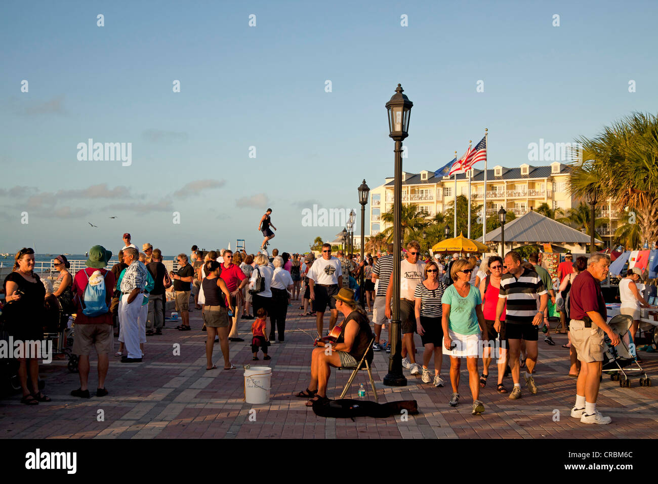 Street performer and pedestrians on Mallory Square in Key West, Florida ...