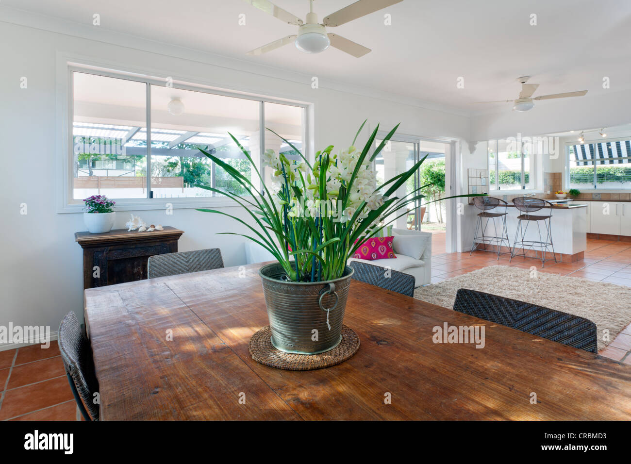 Dining area and kitchen in stylish Australian home Stock Photo - Alamy
