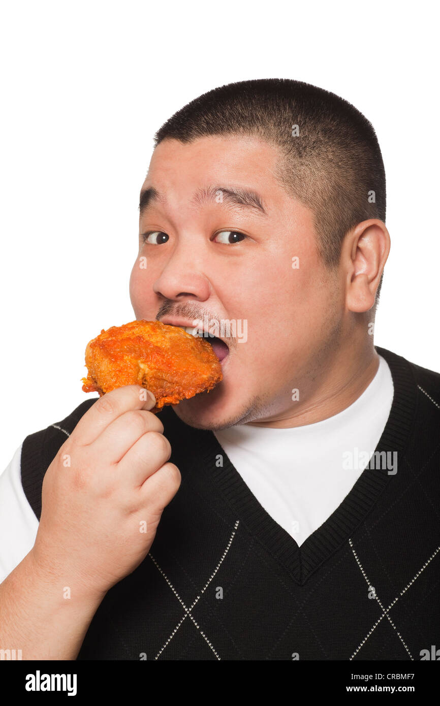 Funny man eating chicken hi-res stock photography and images - Alamy