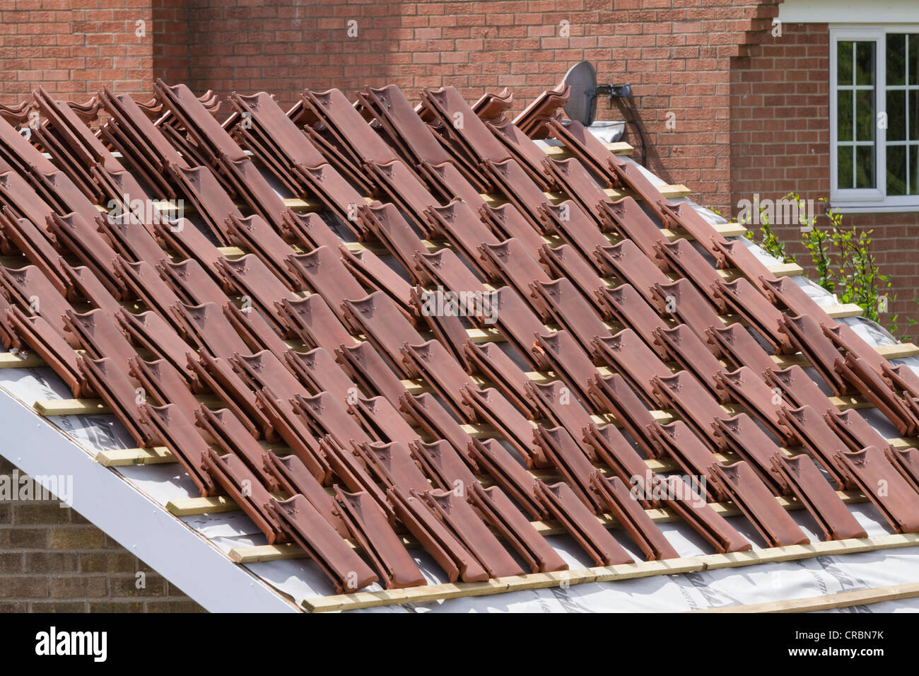 Roof tiles stacked ready for laying Stock Photo - Alamy