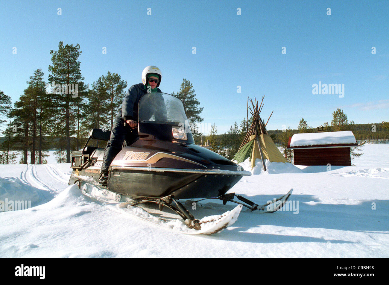 Sámi on snowmobiles (Finnish Lapland Stock Photo - Alamy