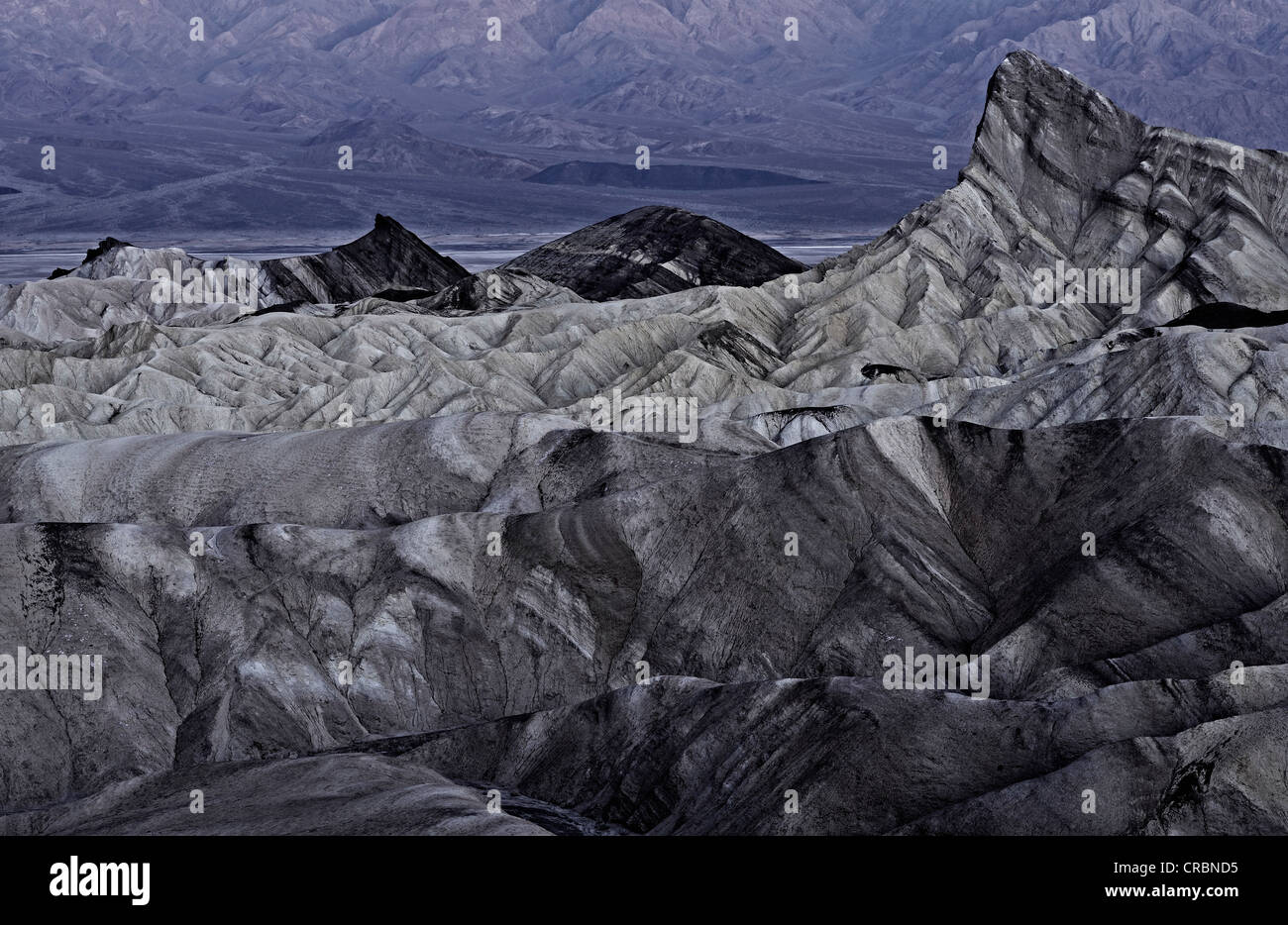 Night view, view from Zabriskie Point to Manly Beacon with eroded rocks ...