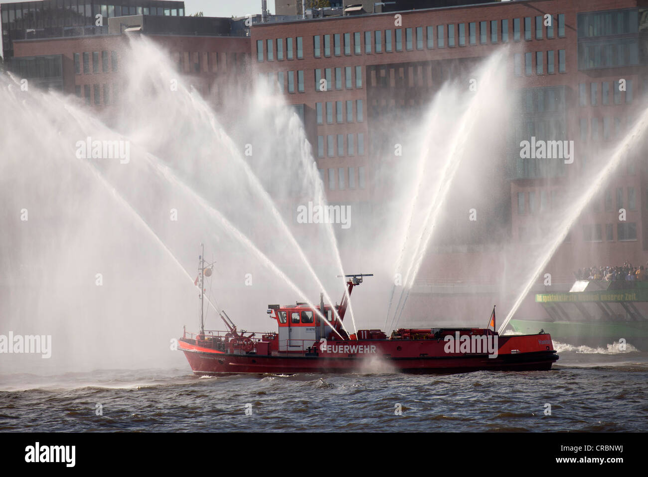 Fire boat spouting water in all directions, Hafengeburtstag or Port ...