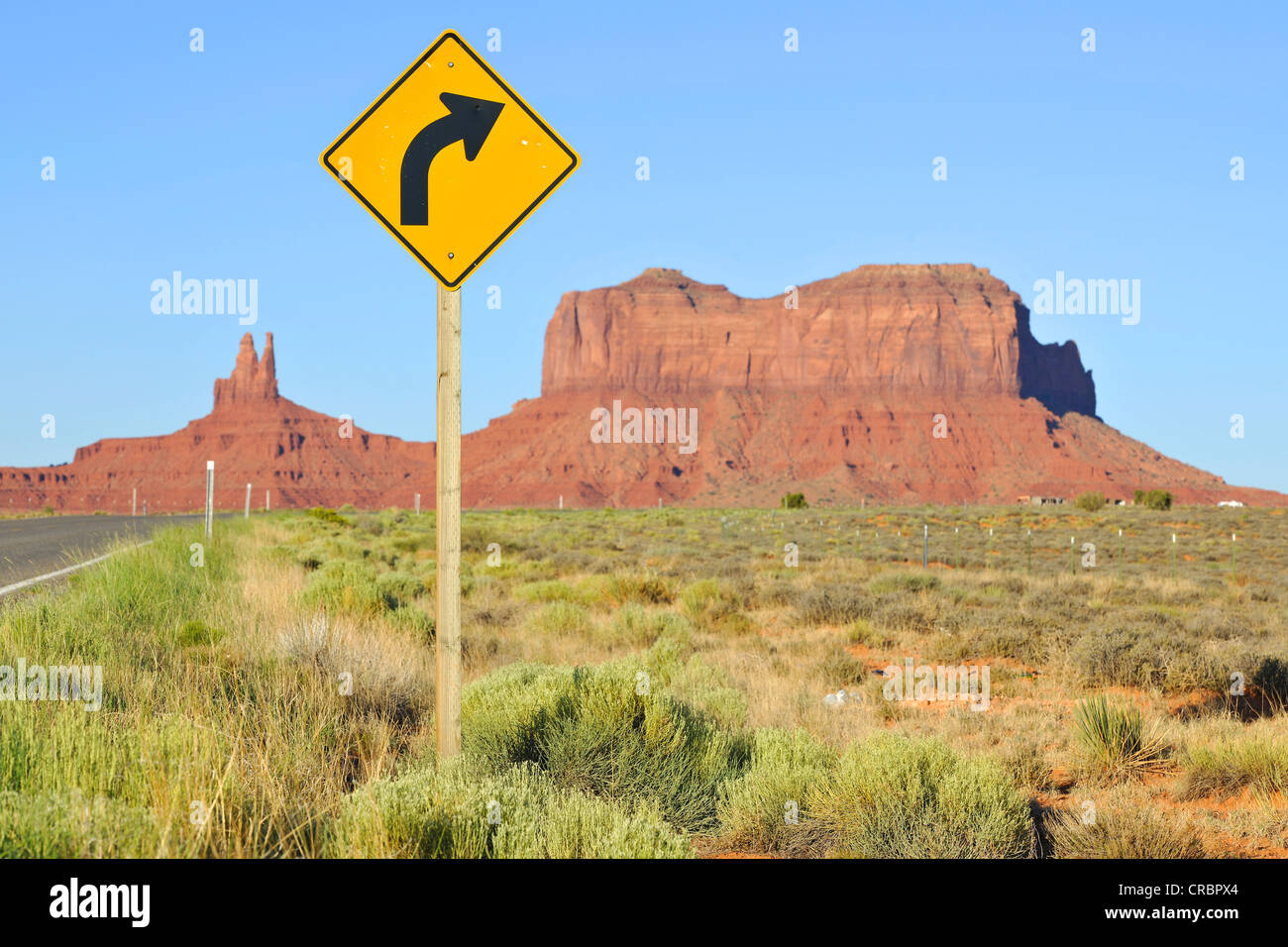 Traffic sign, right curve ahead, mesas, Bringham's Tomb, King on His ... Traffic sign, right curve ahead, mesas, Bringham's Tomb, King on His ...
