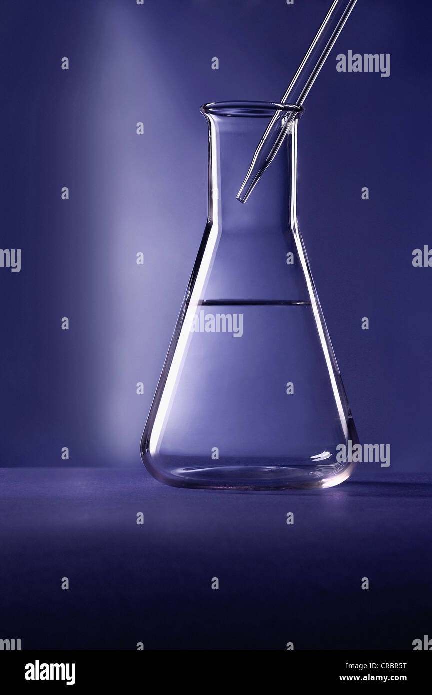 Dropper in graduated cylinder Stock Photo - Alamy