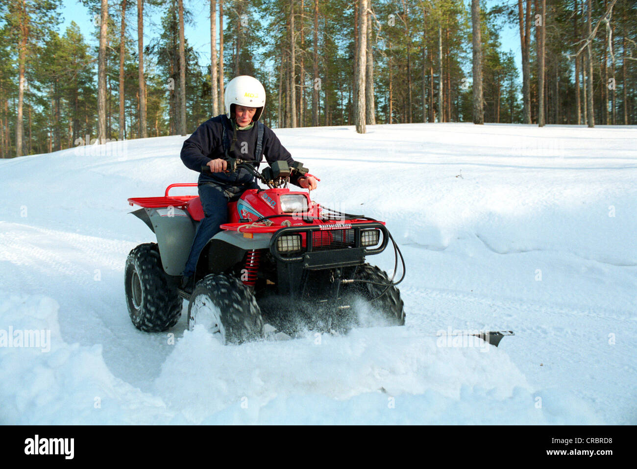 Sámi on motorized snow plow (Finnish Lapland Stock Photo - Alamy