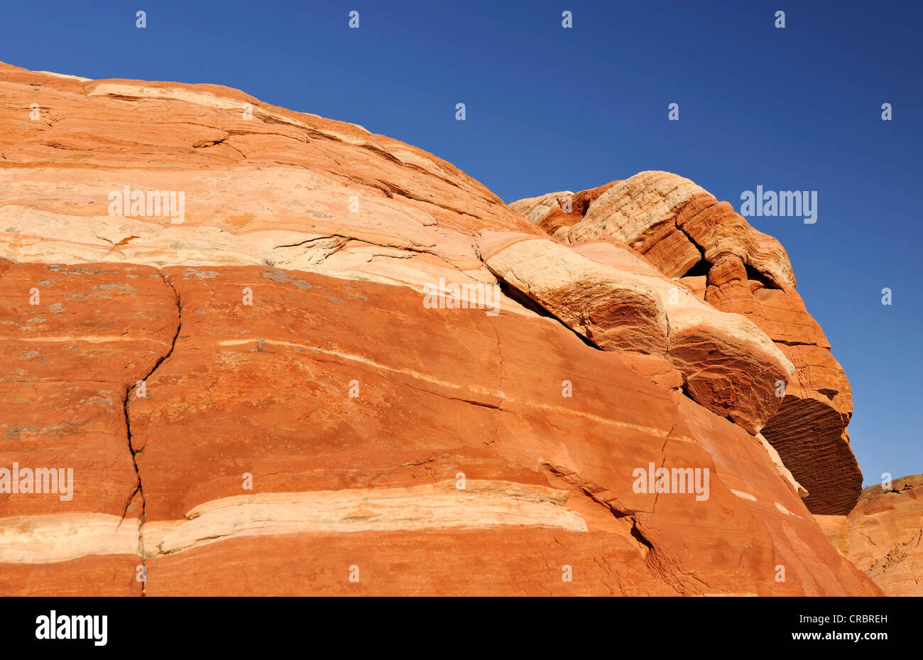The Sheep rock formation, wave of banded and eroded Aztec sandstone ...