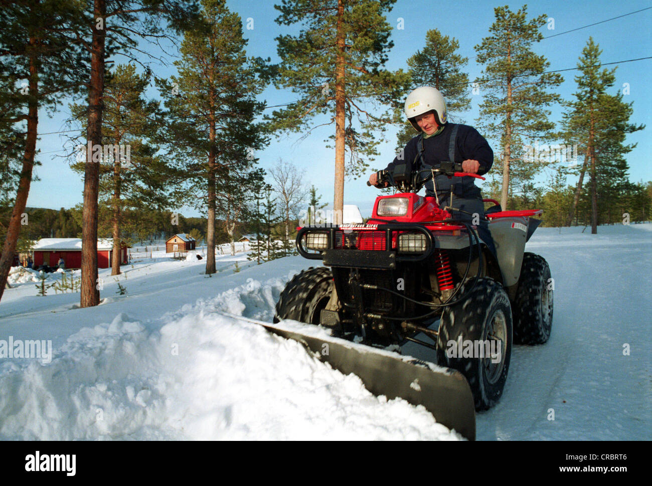 Sámi on motorized snow plow (Finnish Lapland Stock Photo - Alamy
