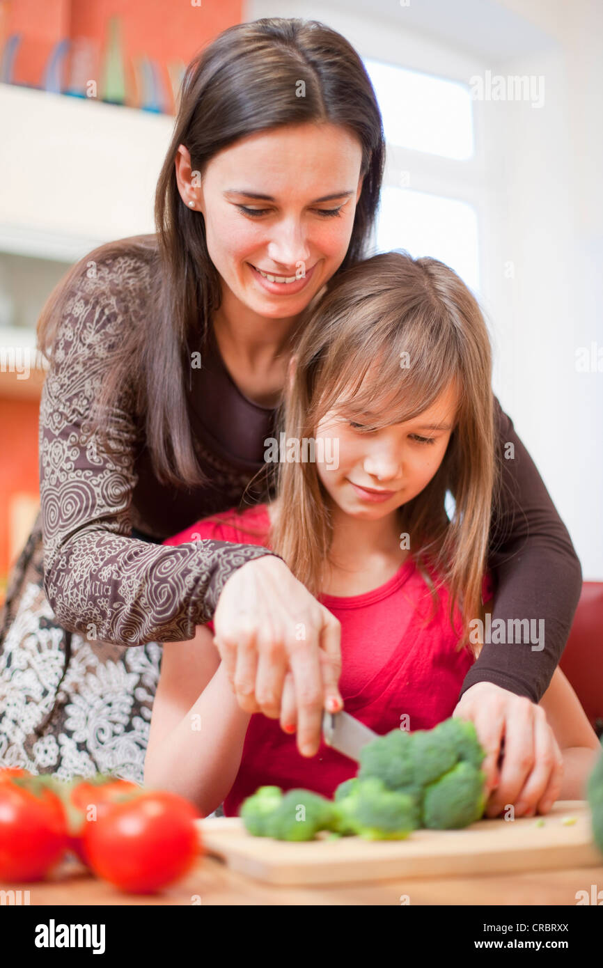 Mother and daughter cooking together Stock Photo - Alamy