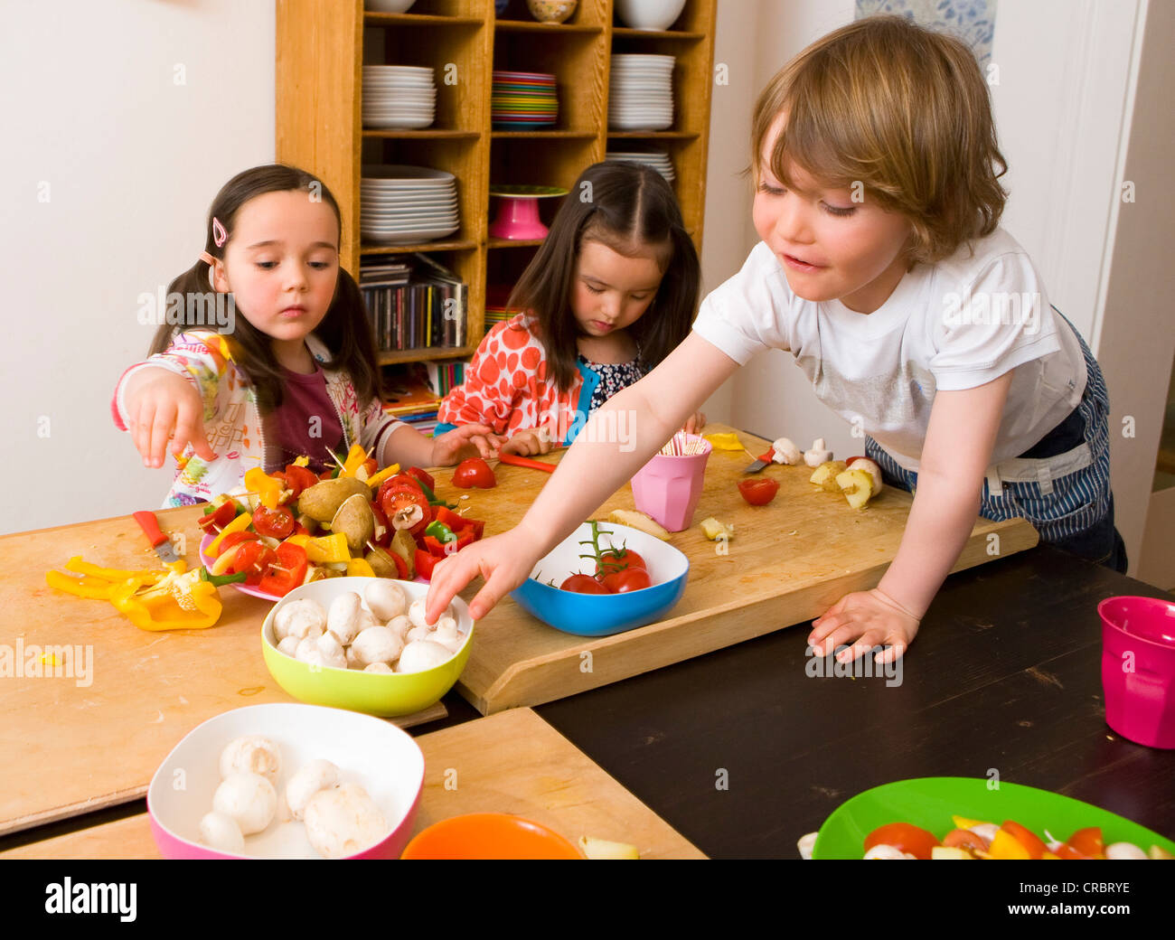 Children cooking together in kitchen Stock Photo - Alamy