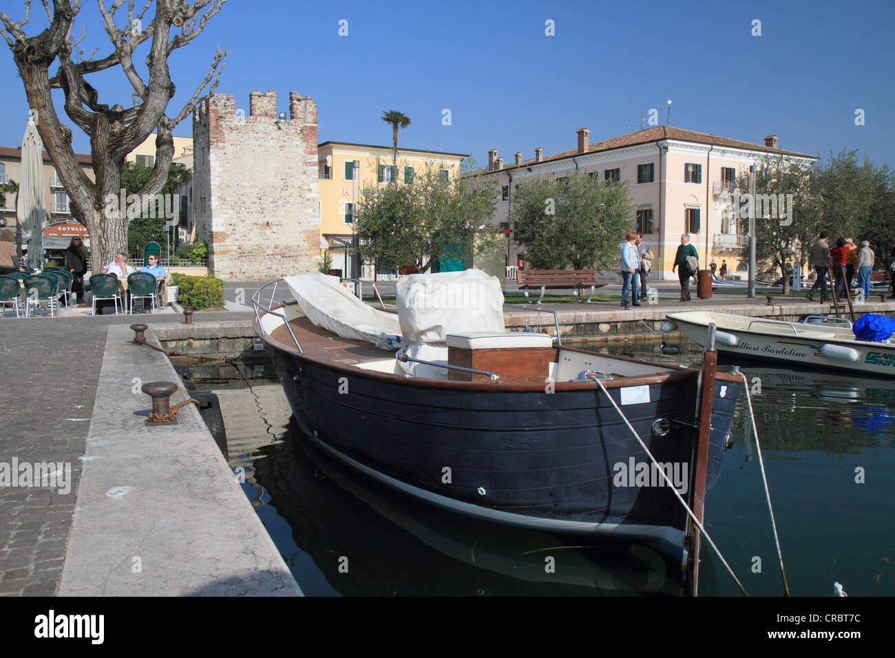 Lakeside promenade with a fishing boat, Bardolino on Lake Garda, province of Verona, Veneto ...