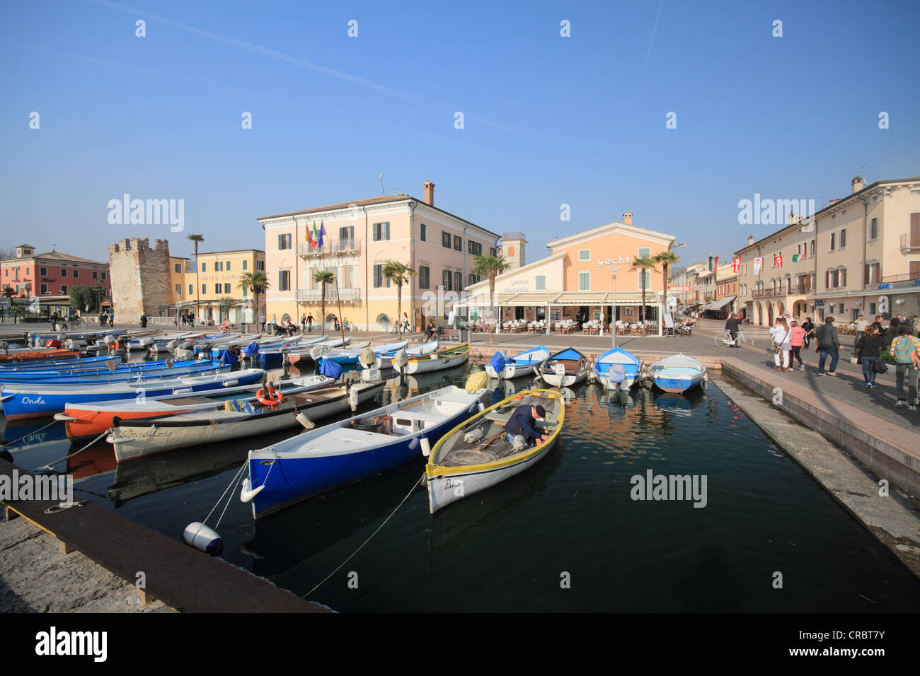 Fishing boats in the harbour and the lakeside promenade, Bardolino on Lake Garda, province of ...