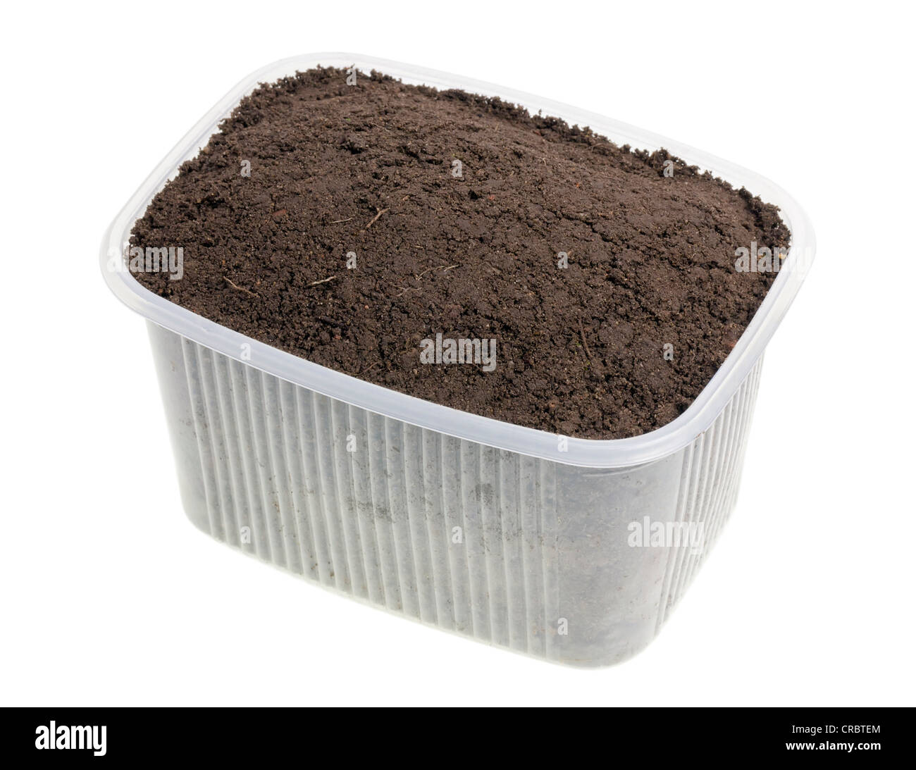 Soil compost for landing of plants in plastic container macro isolated ...