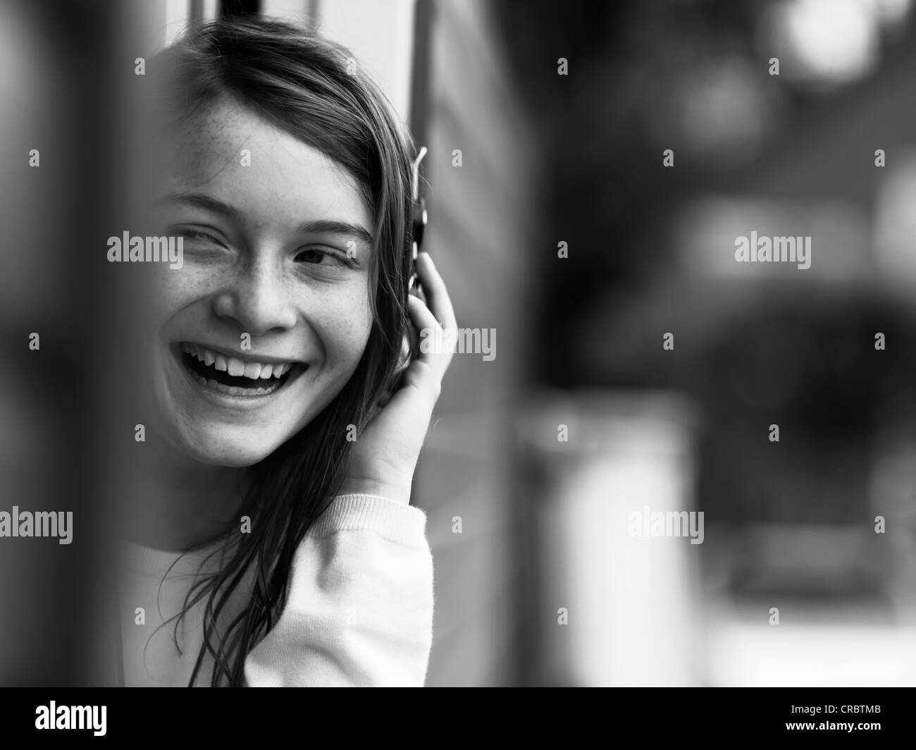 Smiling girl talking on cell phone Stock Photo - Alamy