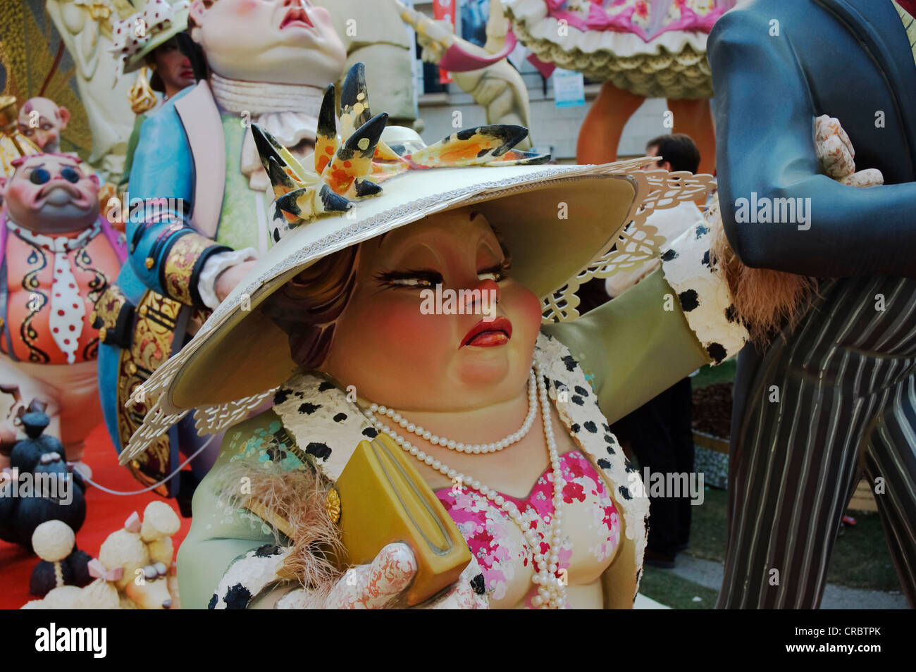 Crude carnival characters and satirical sculptures at a parade, Fallas festival, Falles festival ...