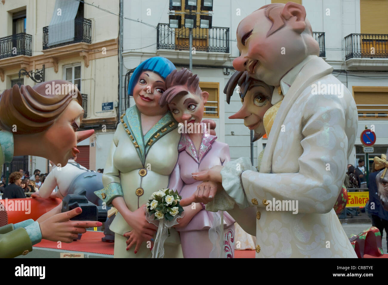 Crude carnival characters and satirical sculptures at a parade, Fallas ...
