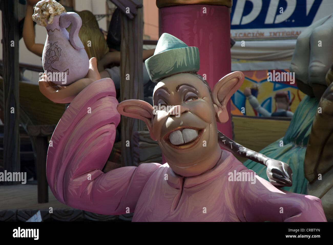 Crude carnival characters and satirical sculptures at a parade, Fallas ...