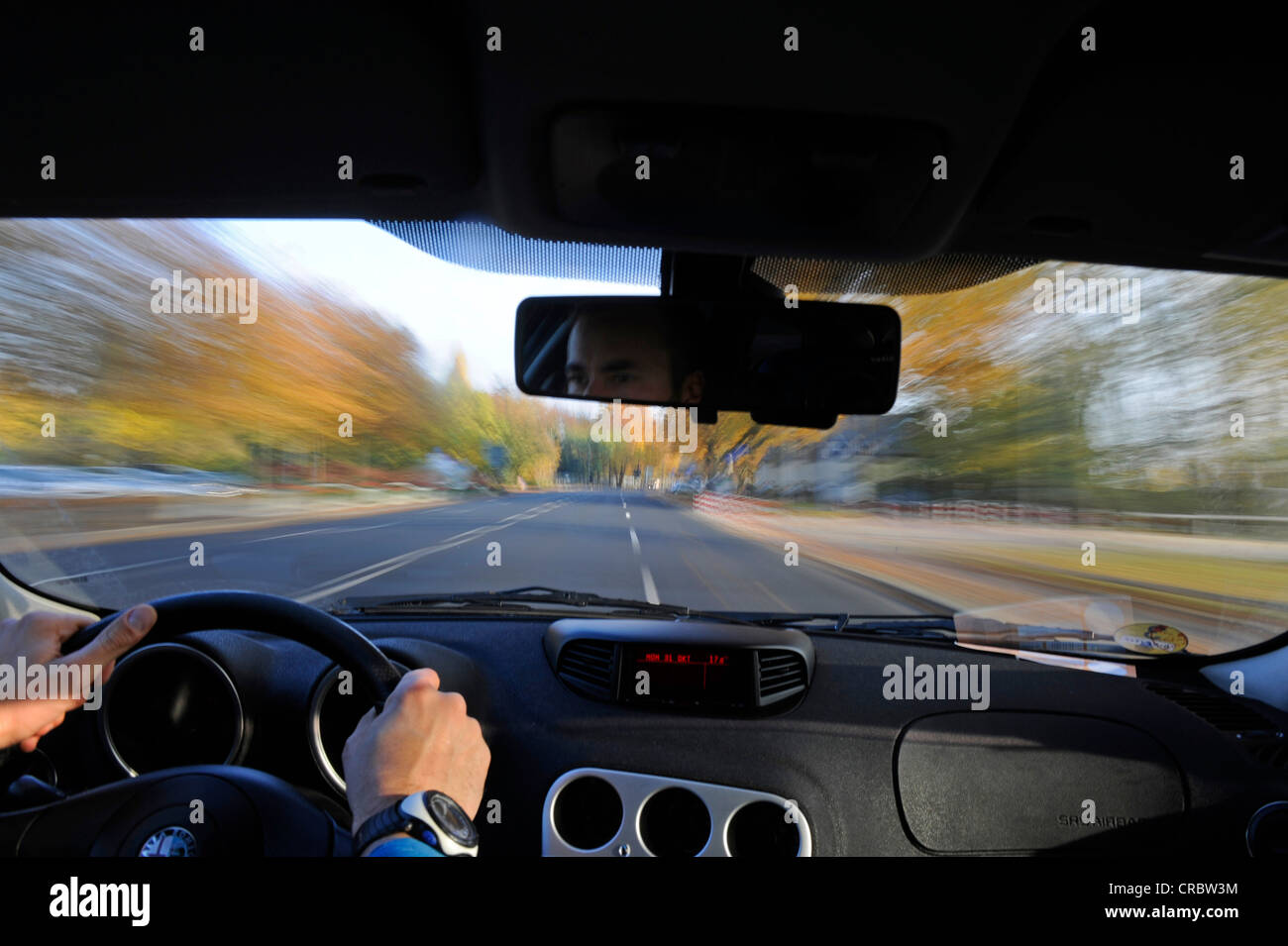 Driver at the wheel of a car whilst driving Stock Photo - Alamy