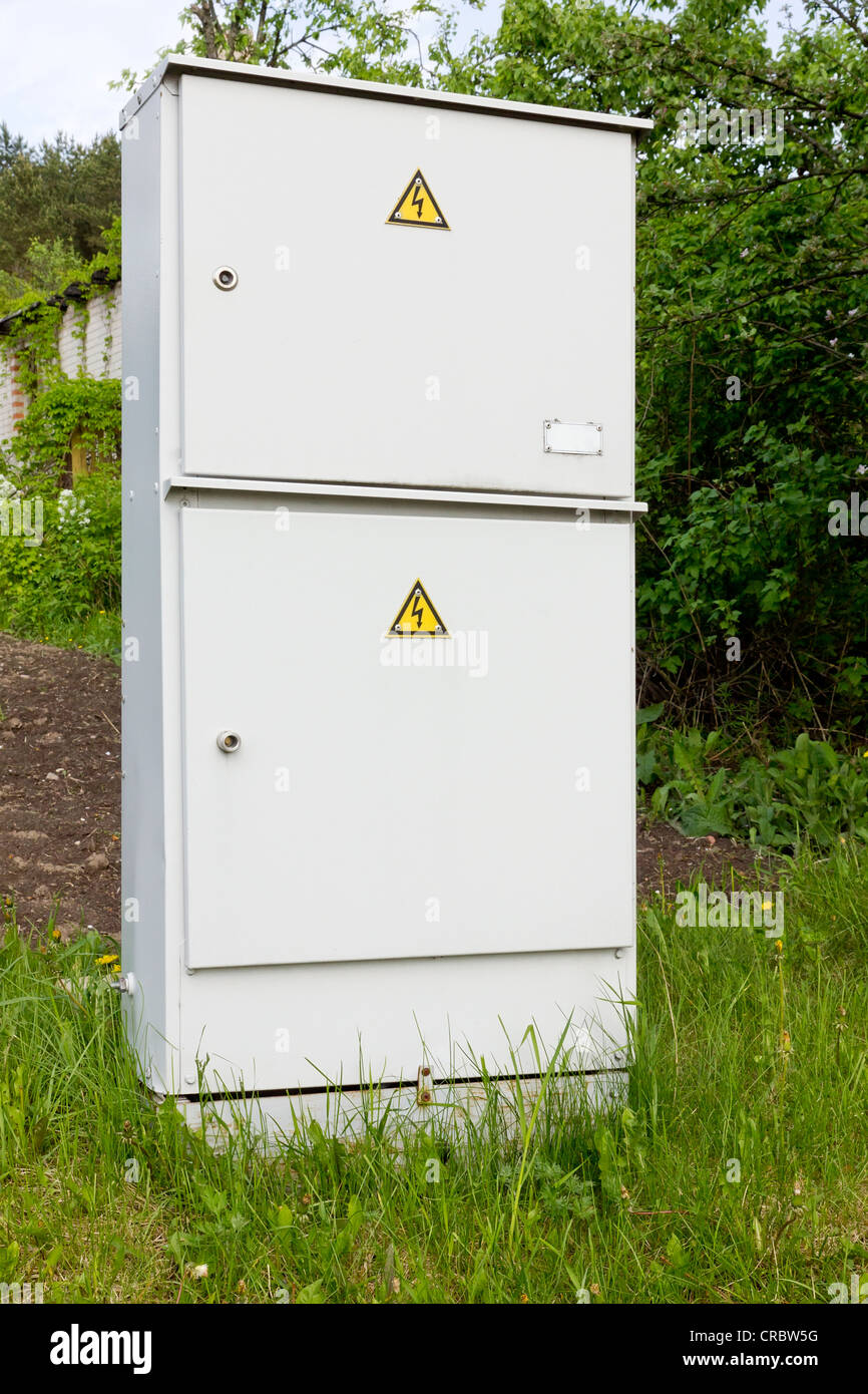 electric connection metal box for small village stand on garden grass ...