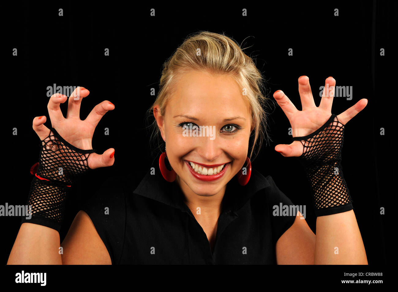 Young woman, vamp, showing her claws, Halloween Stock Photo - Alamy