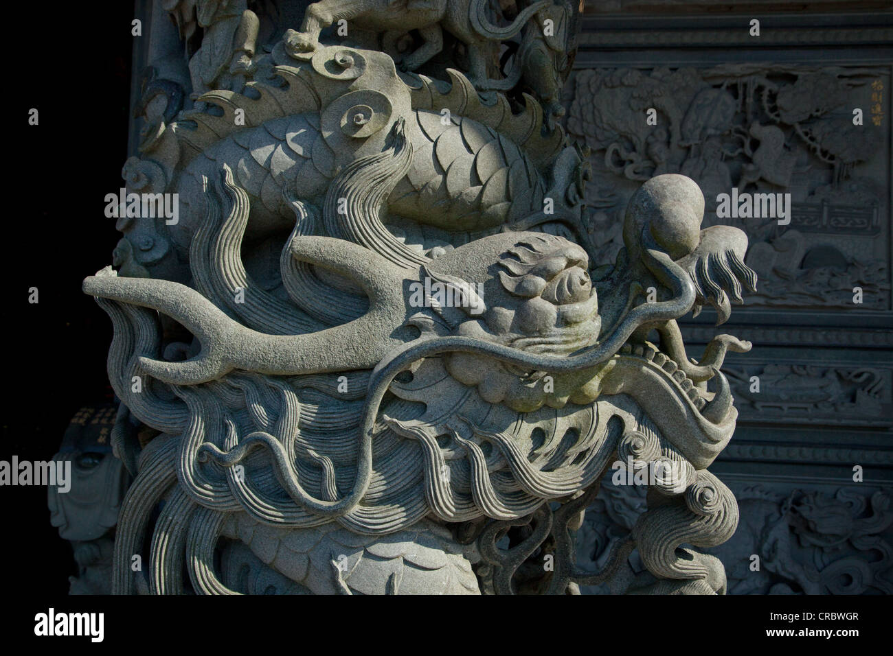 Stone carving of Chinese dragon on pillar of a temple, Jiu Fen, Ruifang ...
