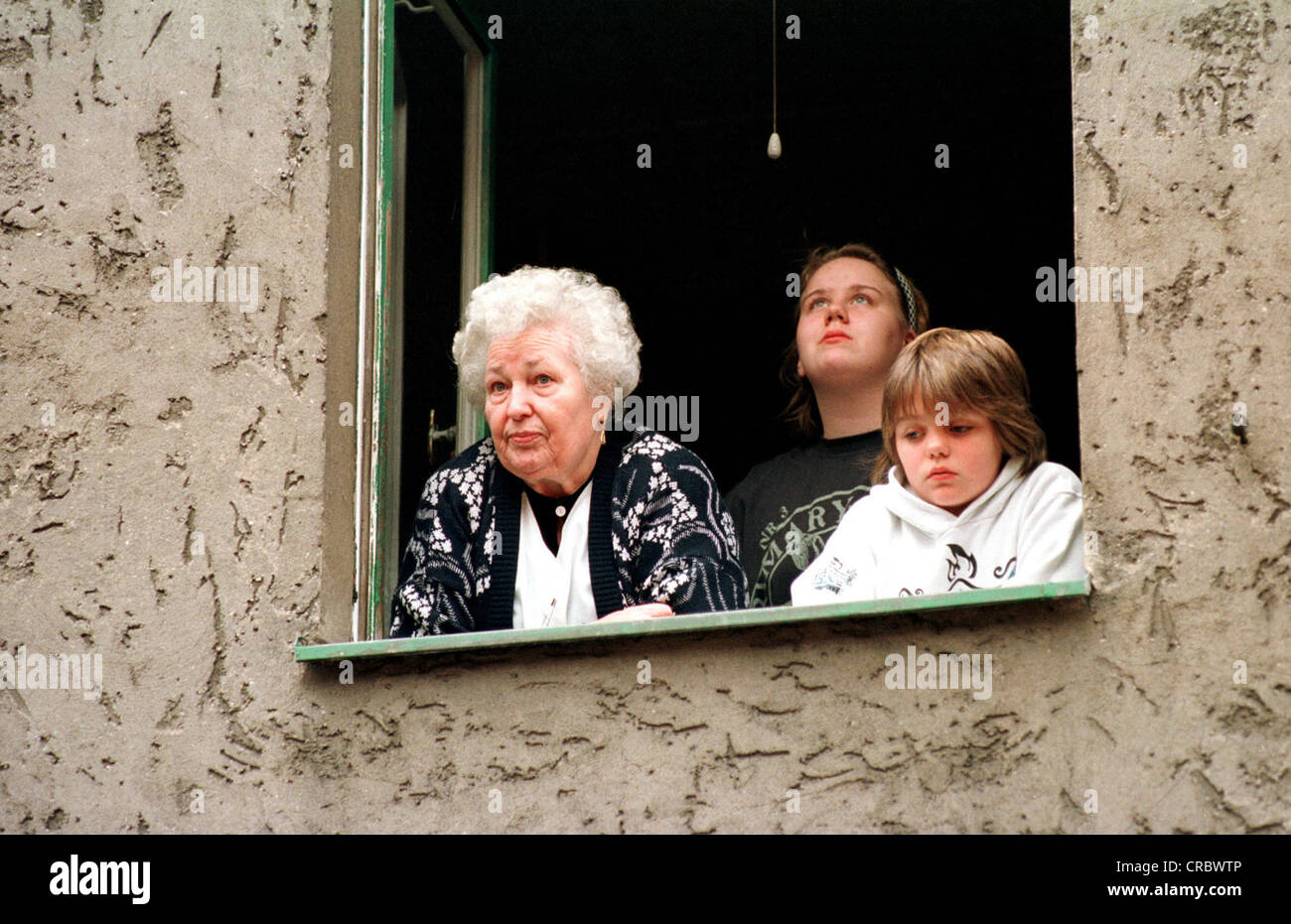 Grandmother and grandchild will look out the window Stock Photo - Alamy
