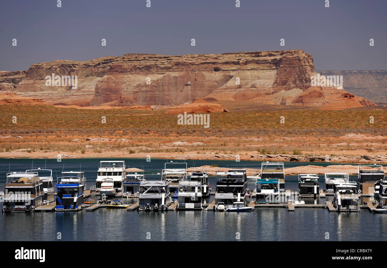 House boats are moored in the harbour of Antelope Point Marina with ...