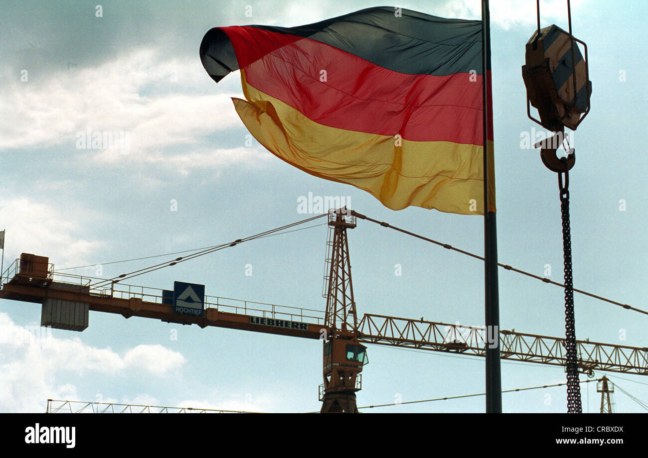 The German flag, with Crane, Berlin, Germany Stock Photo - Alamy